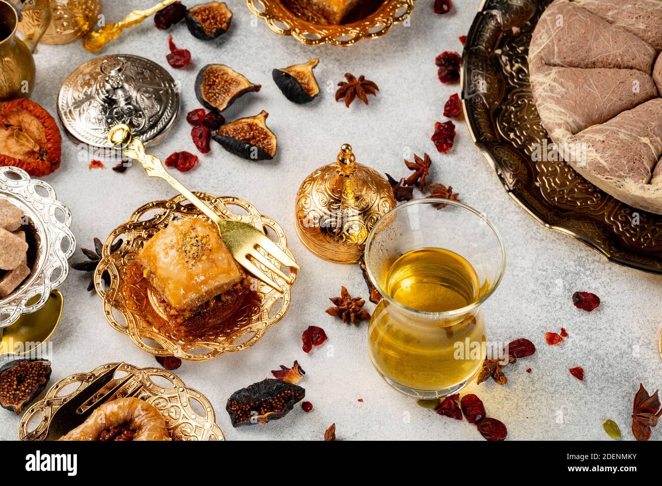 Turkish pastries and scattered dry fruits on table Stock Photo - Alamy