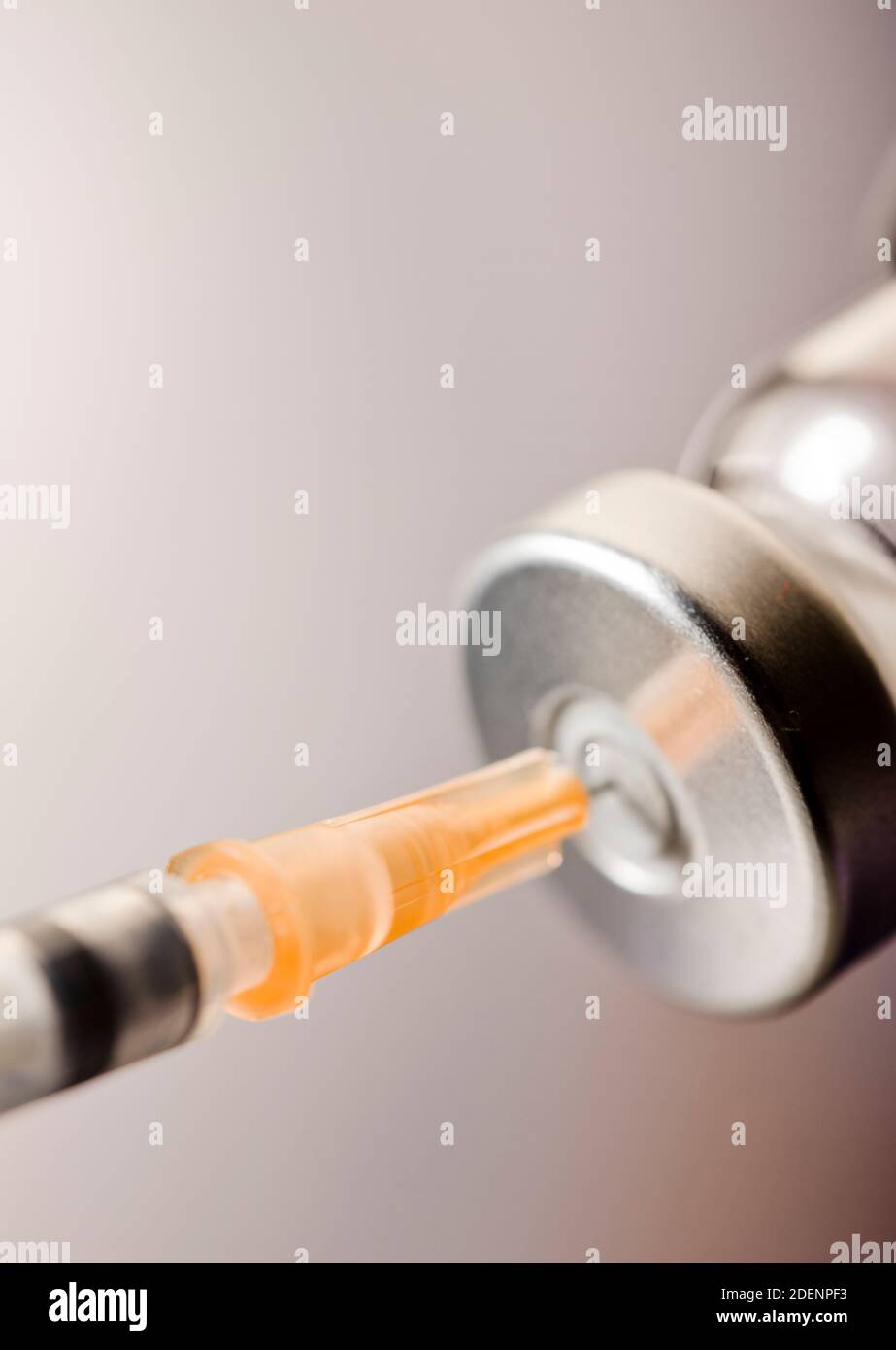 medical syringe cannula with vaccine vial. macro Stock Photo - Alamy