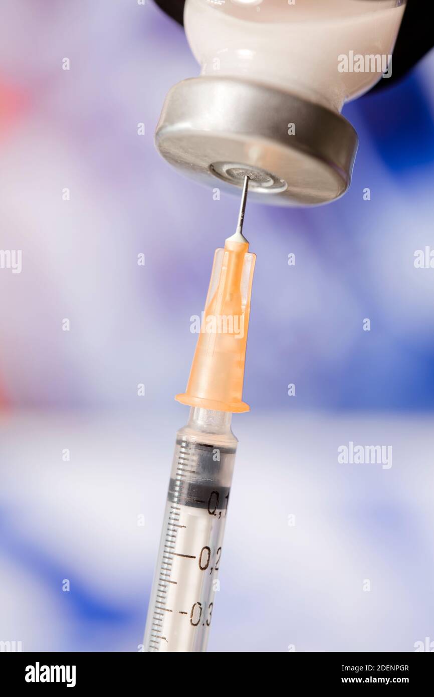 medical syringe cannula with vaccine vial, blue background. macro Stock ...