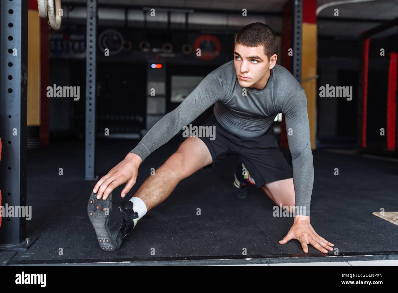 Athlete warming up before a workout at the gym Stock Photo - Alamy