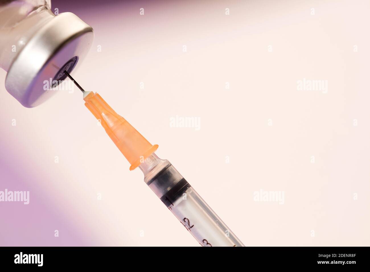 medical syringe cannula with vaccine vial, white background. macro ...