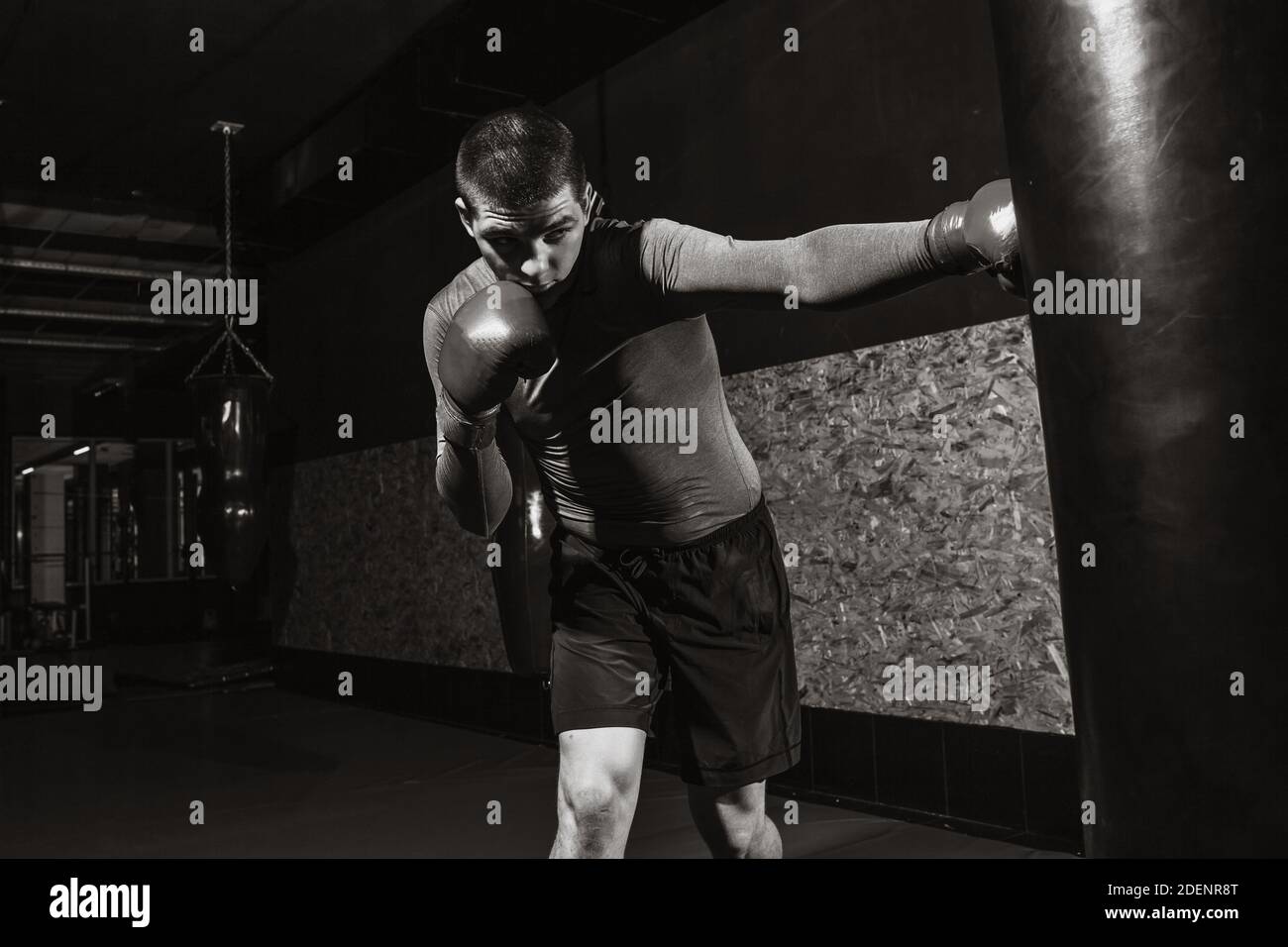 Boxer hitting punching bag in hi-res stock photography and images - Alamy