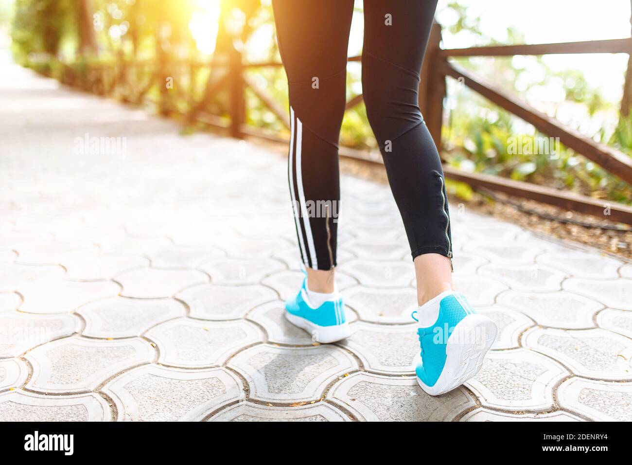 Close-up of the legs of the athlete runner, at sunset Stock Photo - Alamy