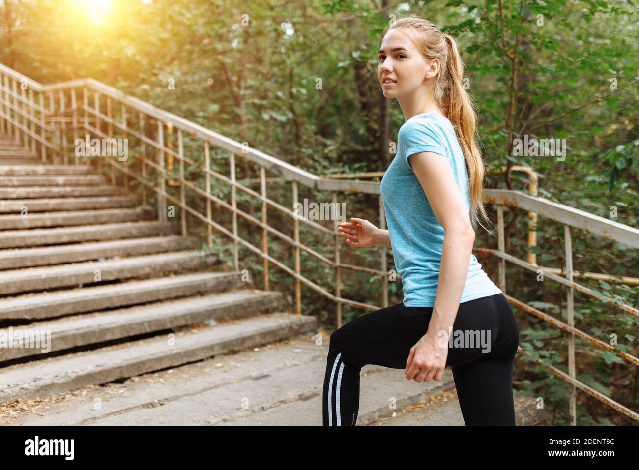 Beautiful young girl is Jogging on the steps Stock Photo - Alamy
