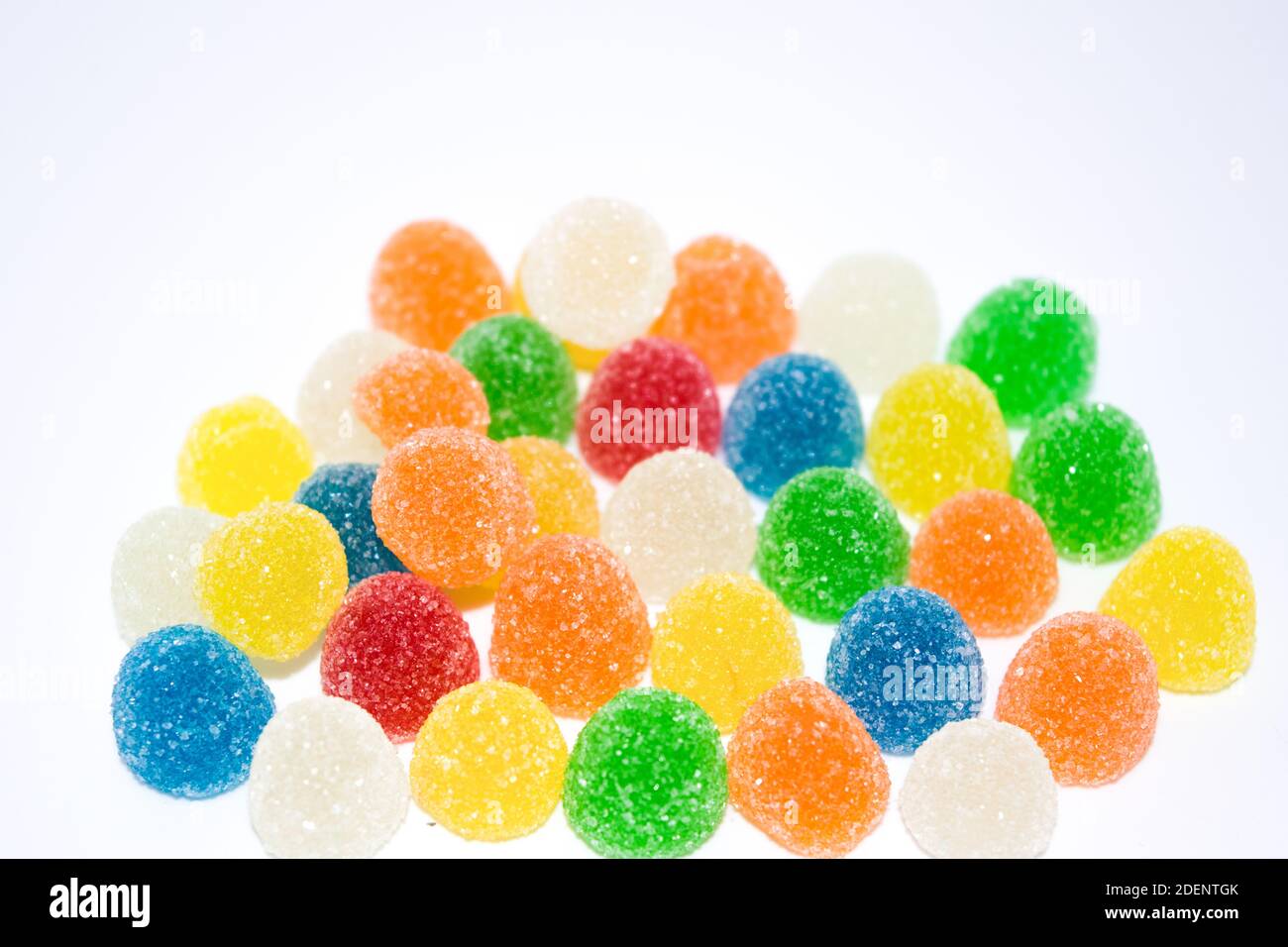 Colorful gummies on white texture Stock Photo - Alamy