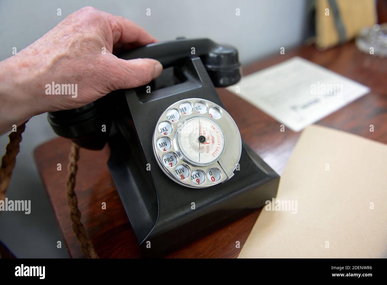 Old bakelite black phone Stock Photo - Alamy