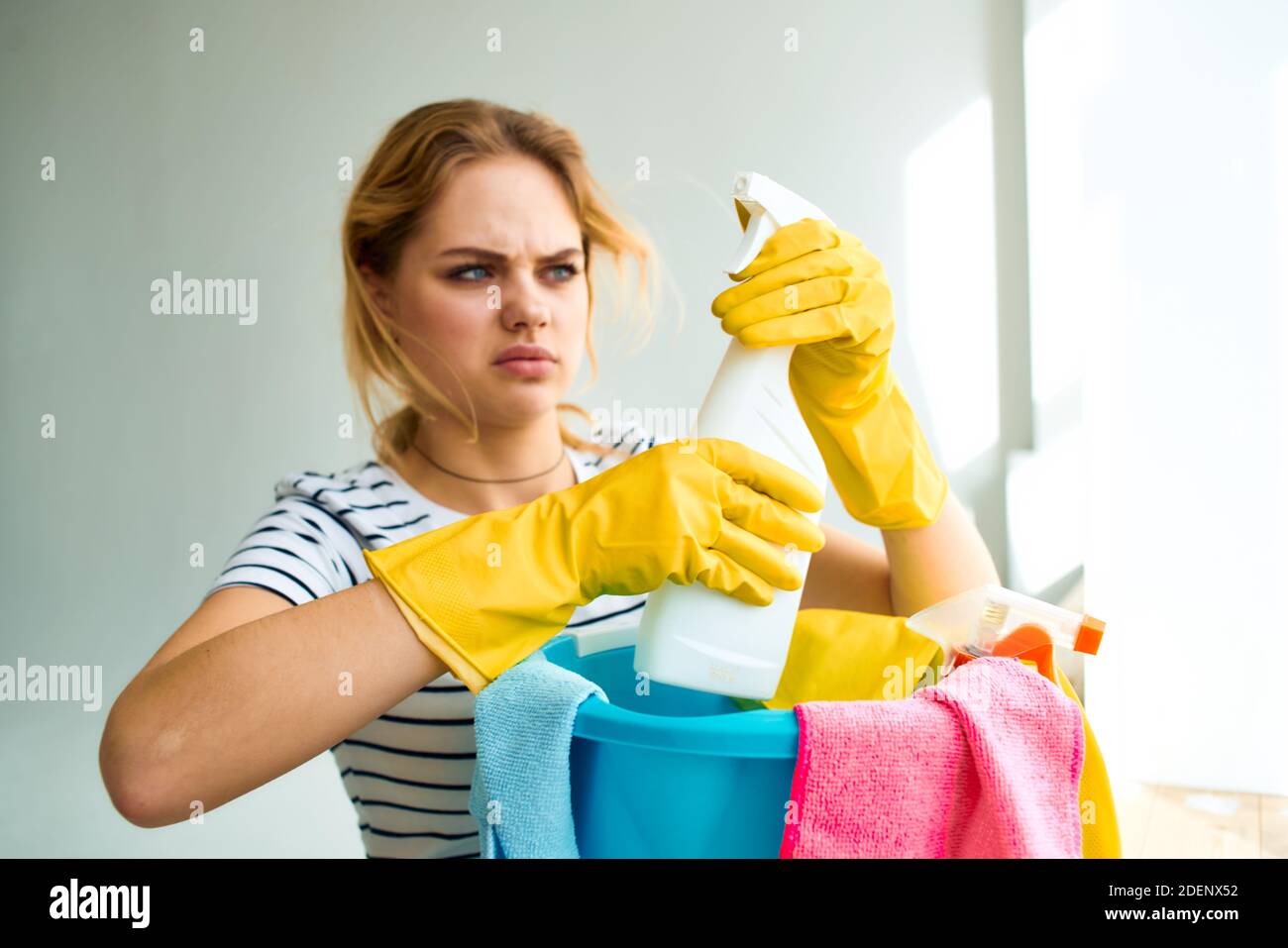 Woman holding in hand detergent cleaning house care lifestyle Stock ...