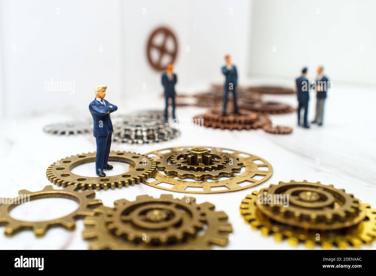 Businessmen surrounded by gears and cogs for innovation conceptual ...