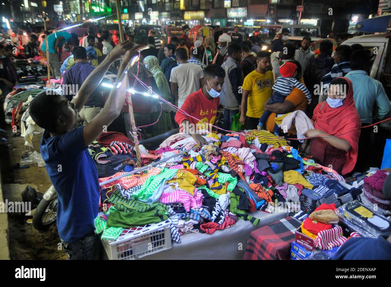 Customers are busy buying winter clothes at street shops in Sylhet ...