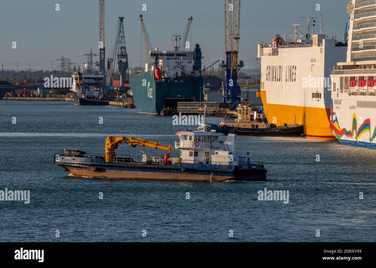 Small boat with crane for rubbish collection hi-res stock photography ...