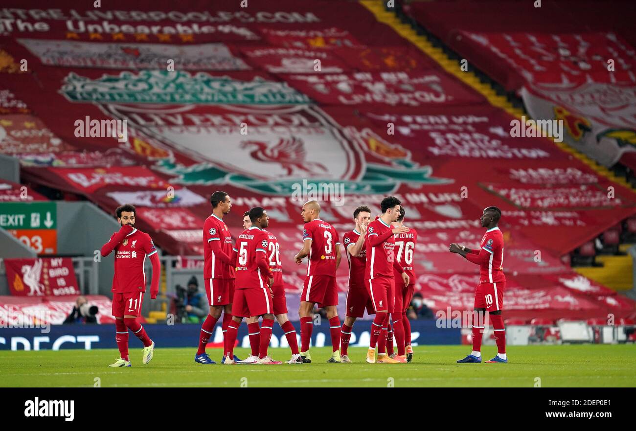 Liverpool players shake hands with each other before the UEFA Champions ...