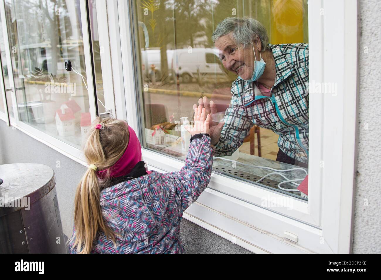 An elderly resident of a nursing home and her granddaughter making ...