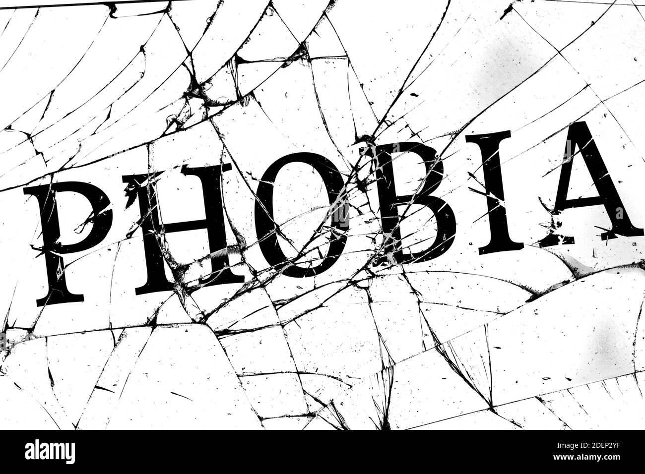 broken glass with cracks with the inscription phobia Stock Photo - Alamy