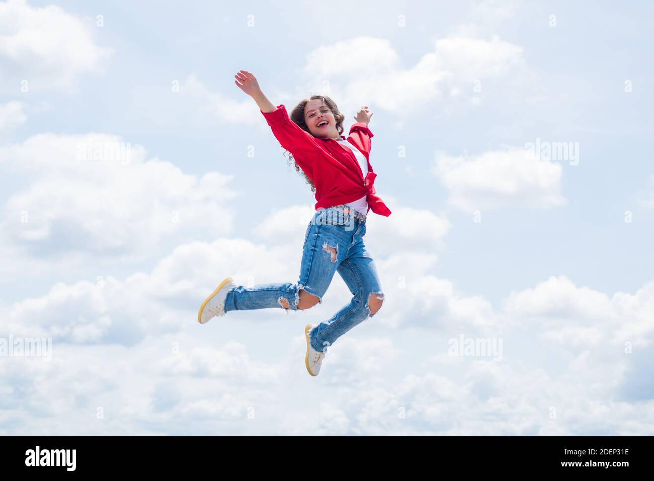 happy energetic kid feeling free and jumping high, freedom Stock Photo ...