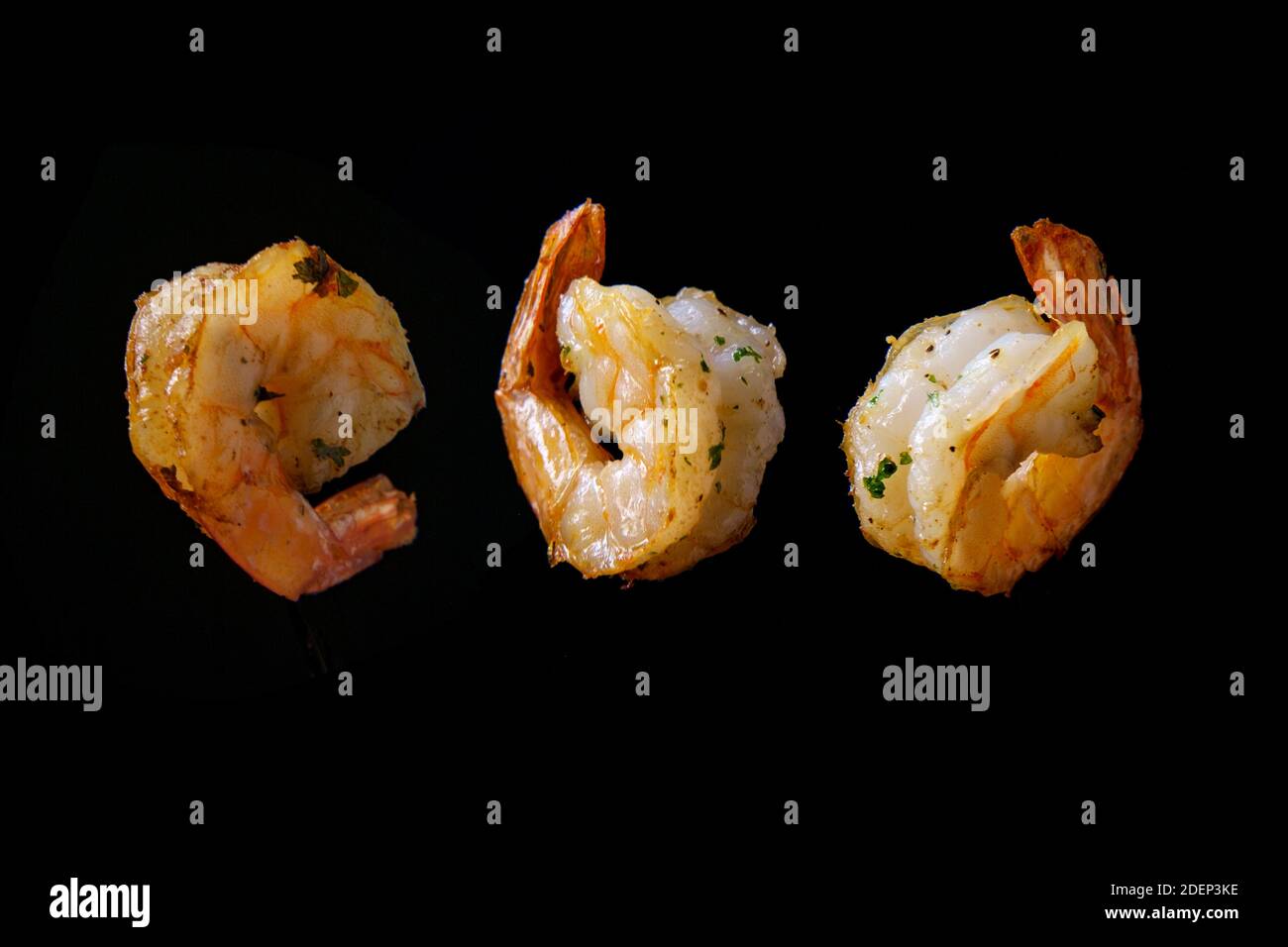 Stir frying and tossing shrimp floating in air closeup Stock Photo - Alamy