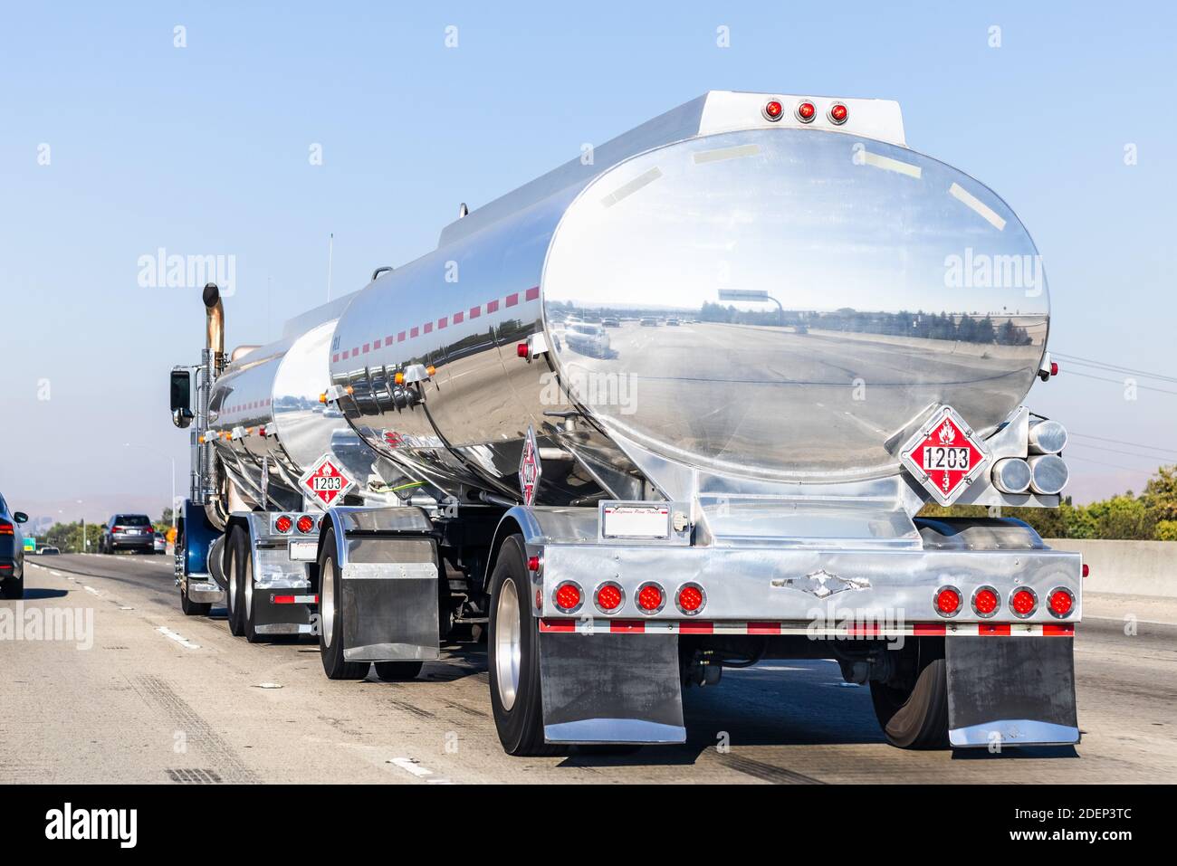 Tanker truck driving on the freeway Stock Photo - Alamy