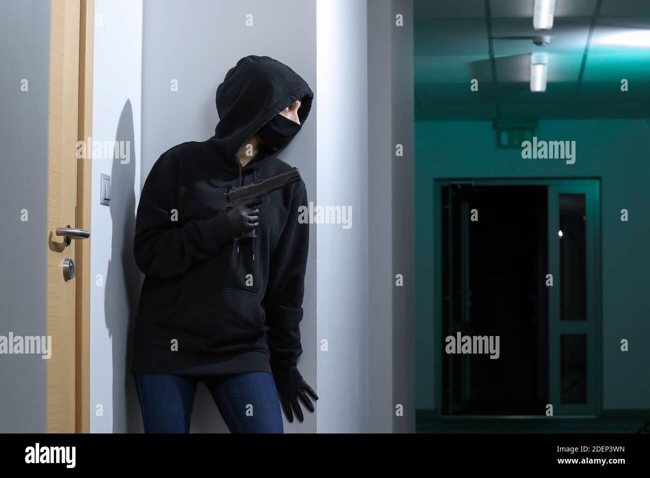 Thief broke into the apartment. House robbery by woman in a black ...