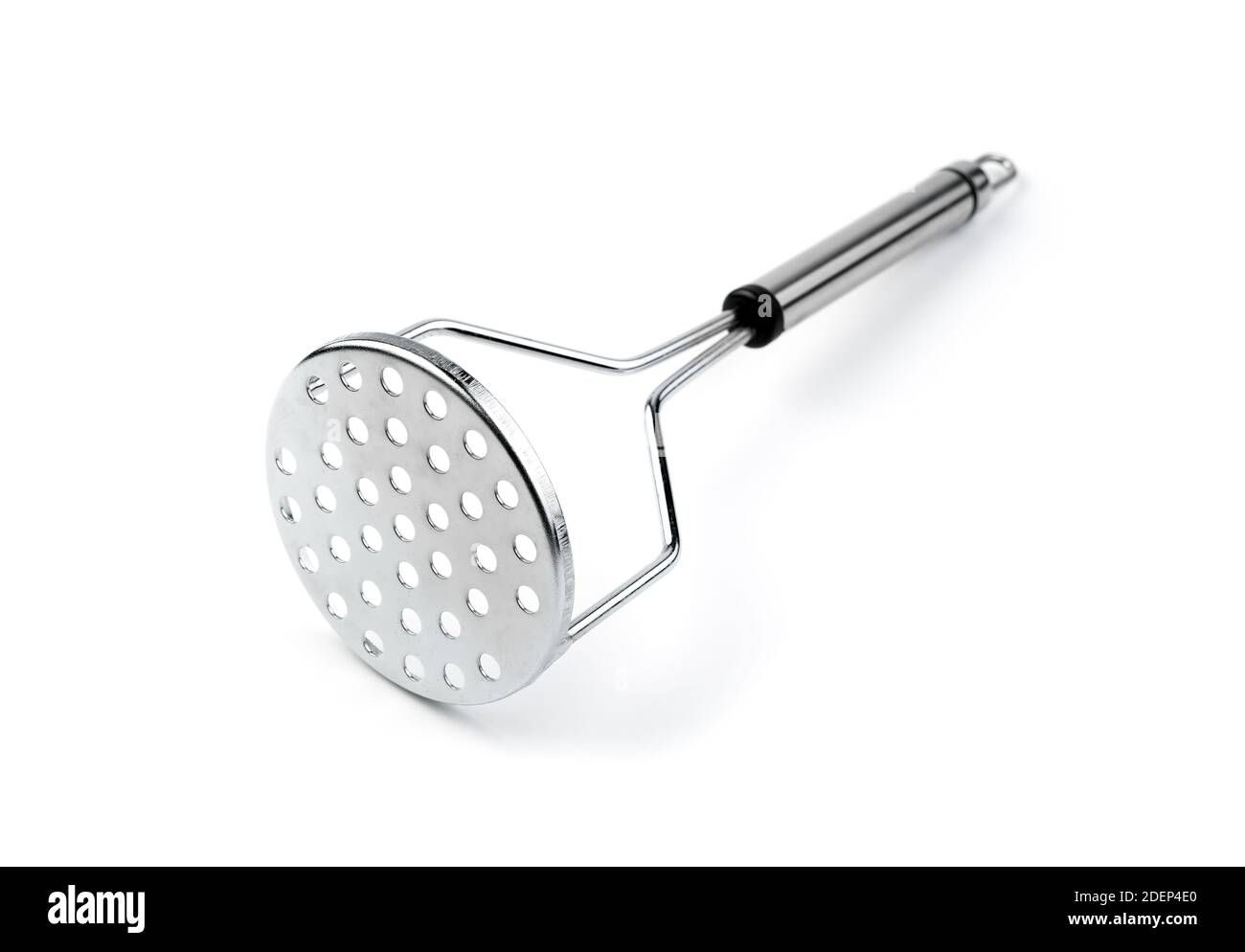 Metal cooking item for making mashed potatoes on a white background ...