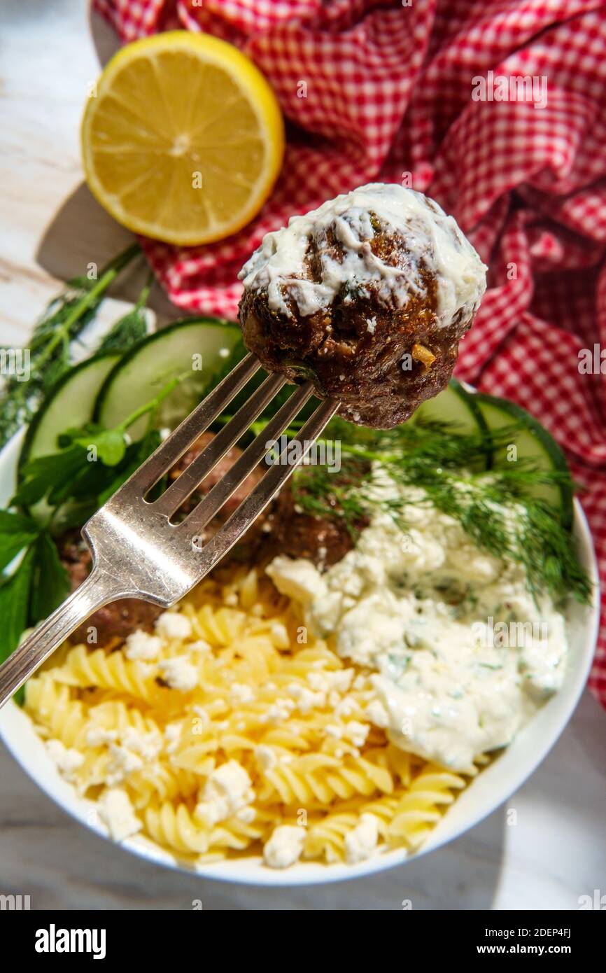 Greek lamb keftedes meatballs with tzatziki yogurt sauce served with ...