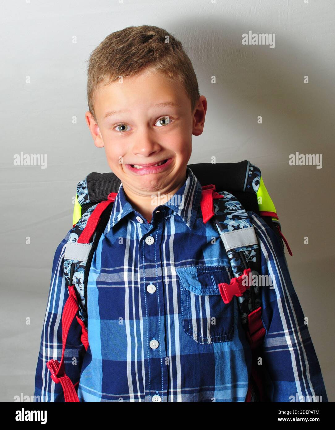 European child with school bag is afraid to go to school Stock Photo ...