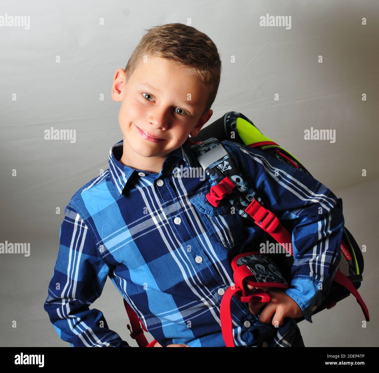 European child with school bag is afraid to go to school Stock Photo ...