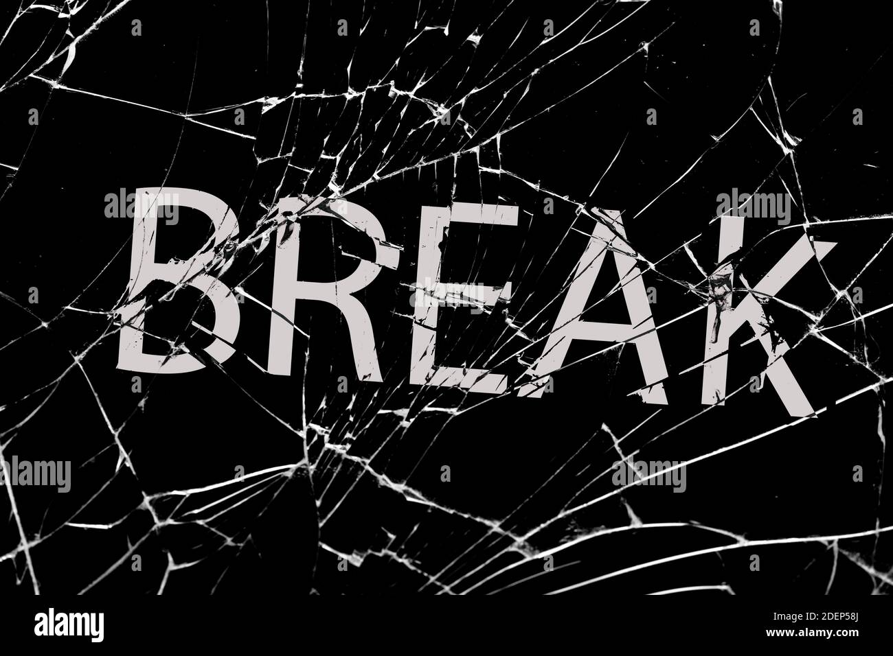 broken glass with cracks with the inscription break Stock Photo - Alamy
