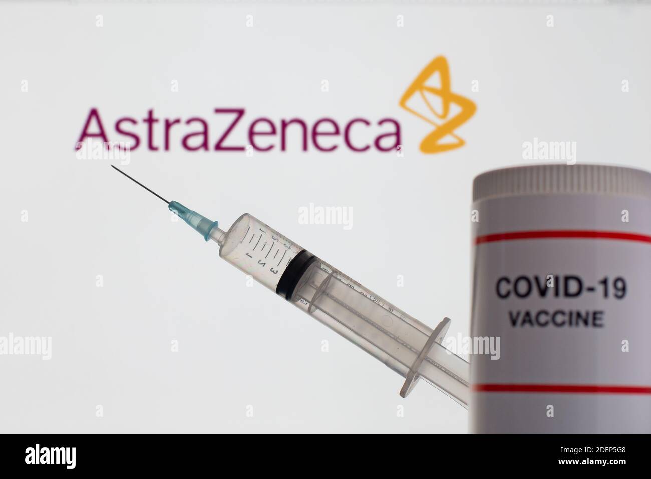 Astra Zeneca logo and Covid-19 vaccine in a bottle and a syringe on ...