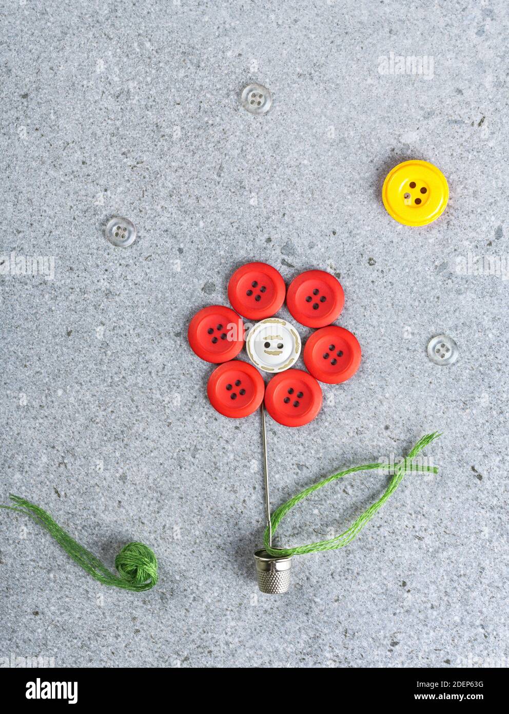 Sewing theme creative flat lay design: flower in a flower pot under the ...