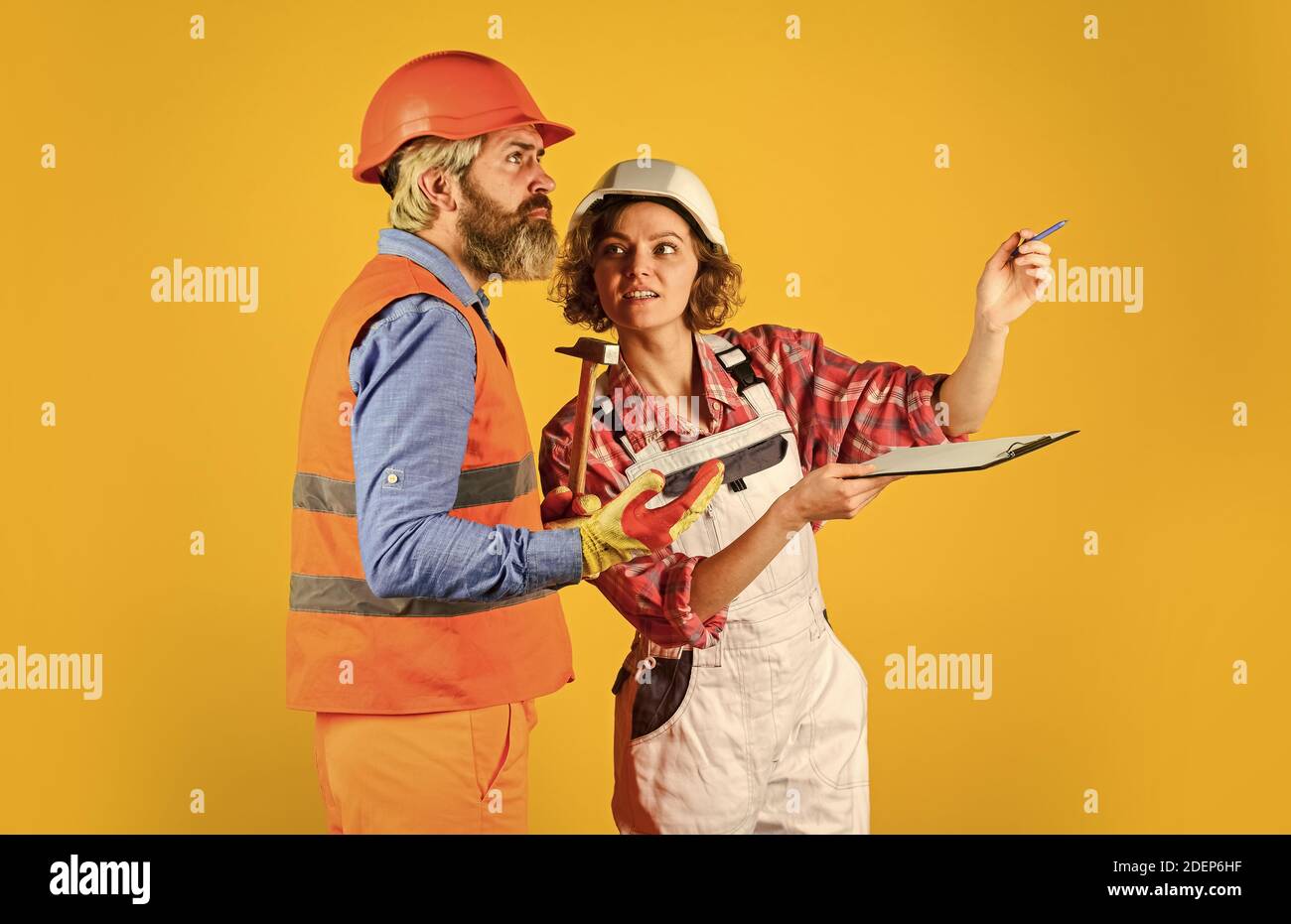 partnership. Builder Couple Look At Home Plans. couple looking at a ...