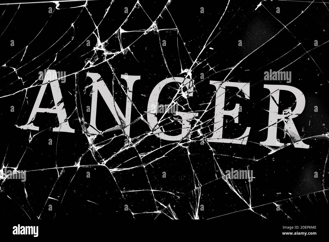 broken glass with cracks with the inscription anger Stock Photo - Alamy