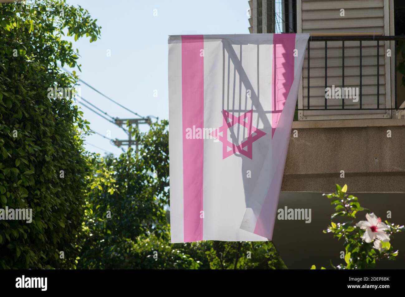 Pink version of the Israeli flag, hanged from a balcony in the city of ...