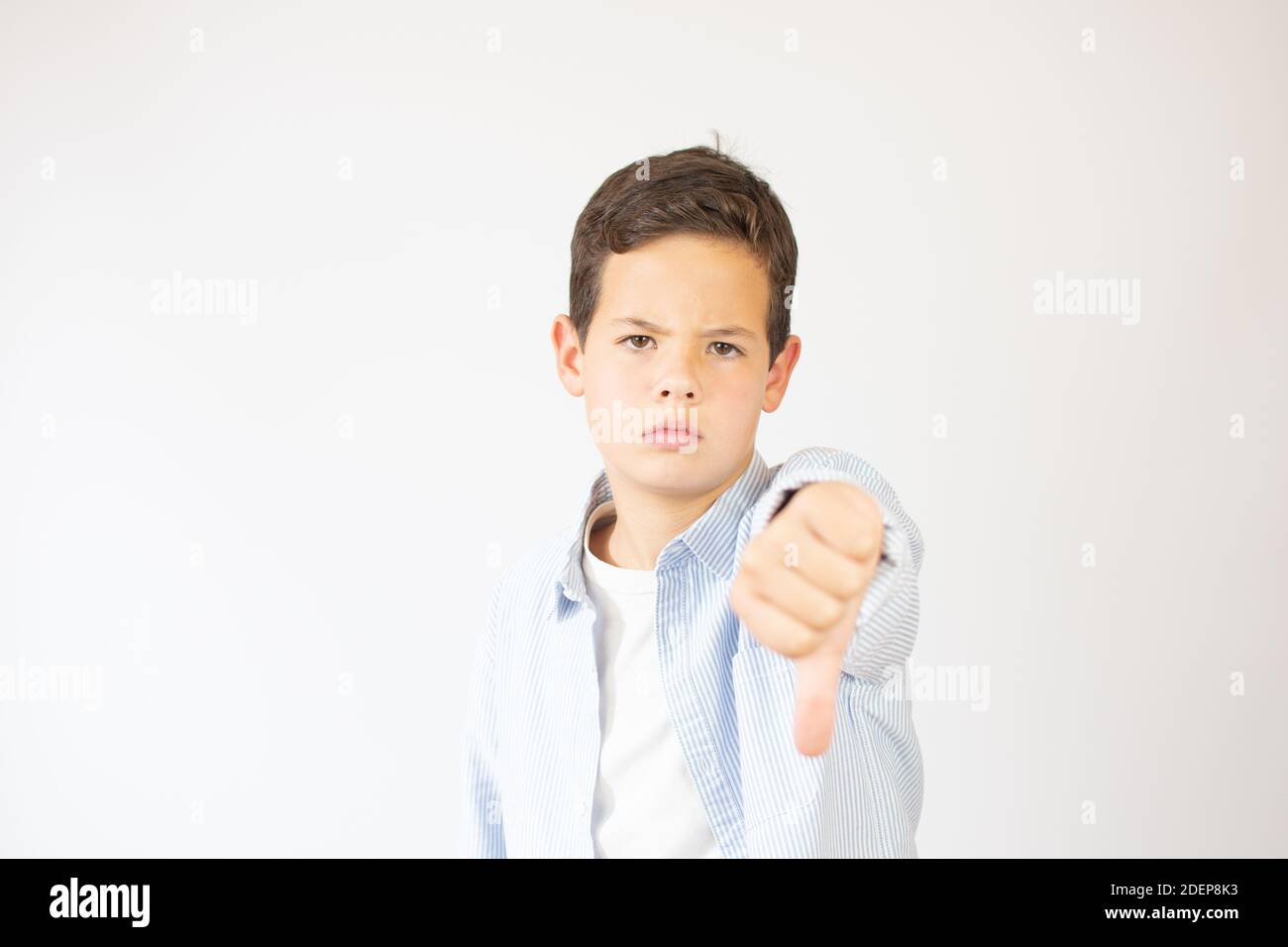 Little boy caucasian kid wearing casual clothes looking unhappy and ...
