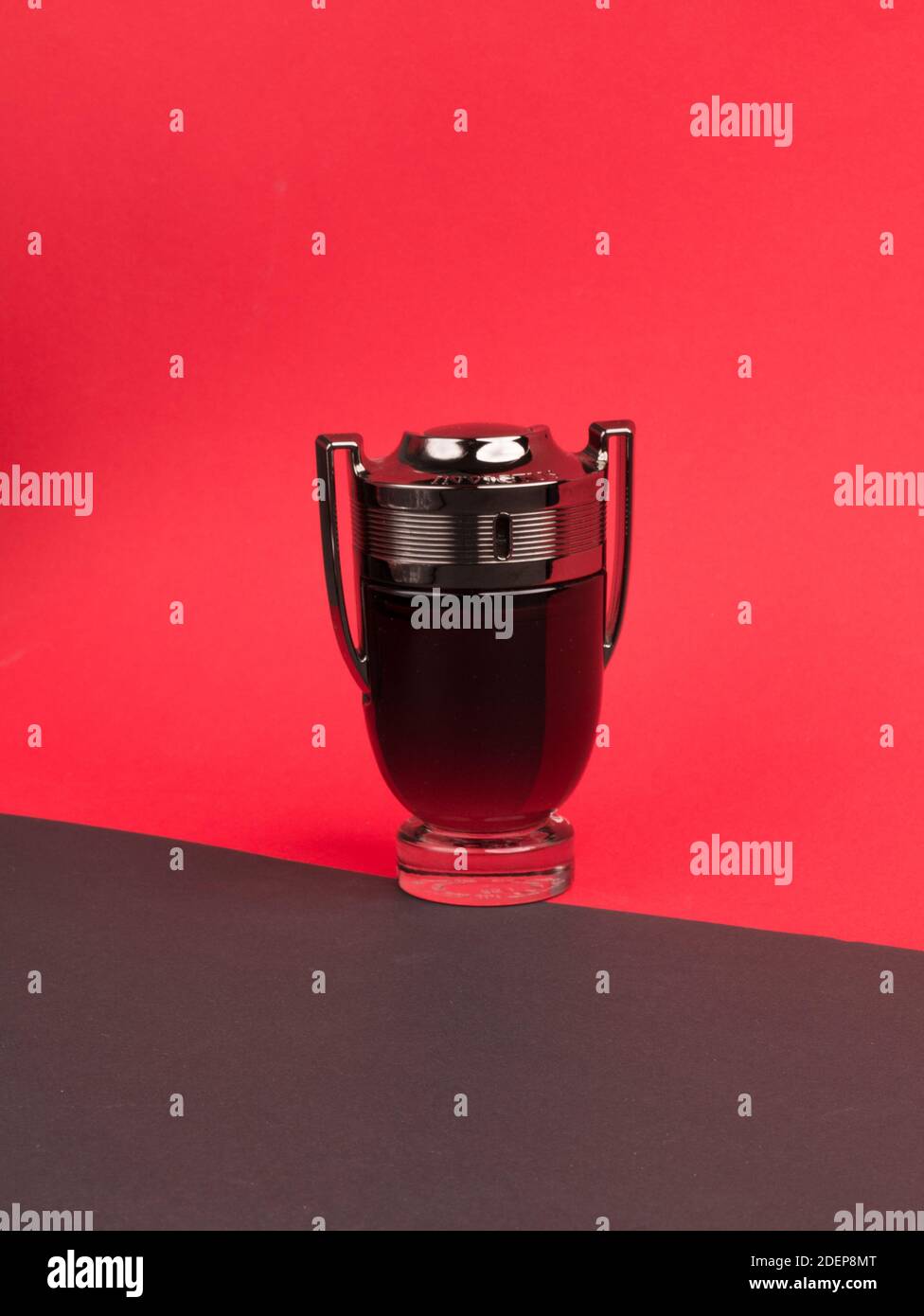 A bottle of Invictus Paco Rabanne 100 ml on colored background. USA ...