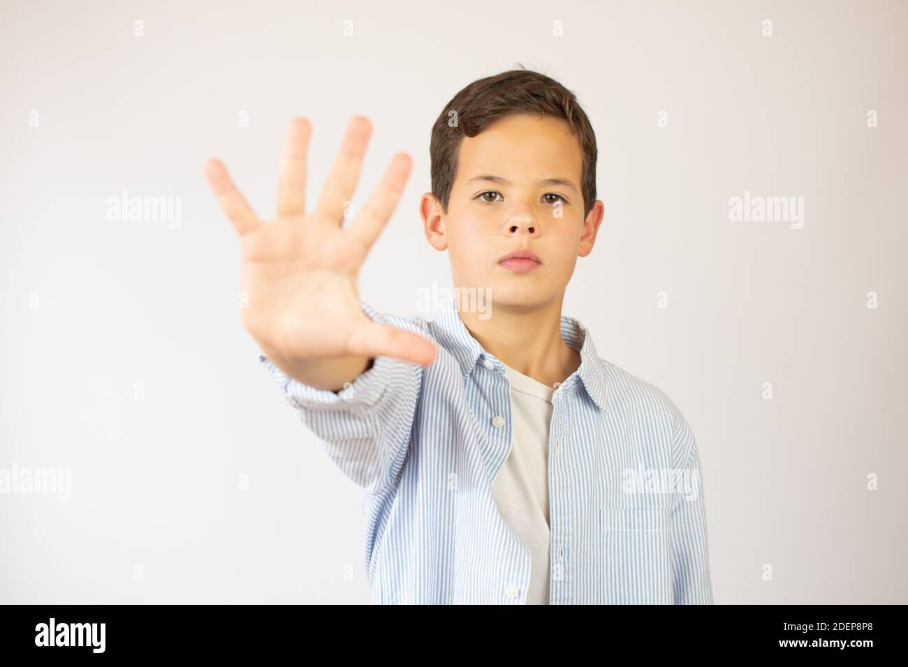 cool young boy showing number five isolated on white background Stock ...