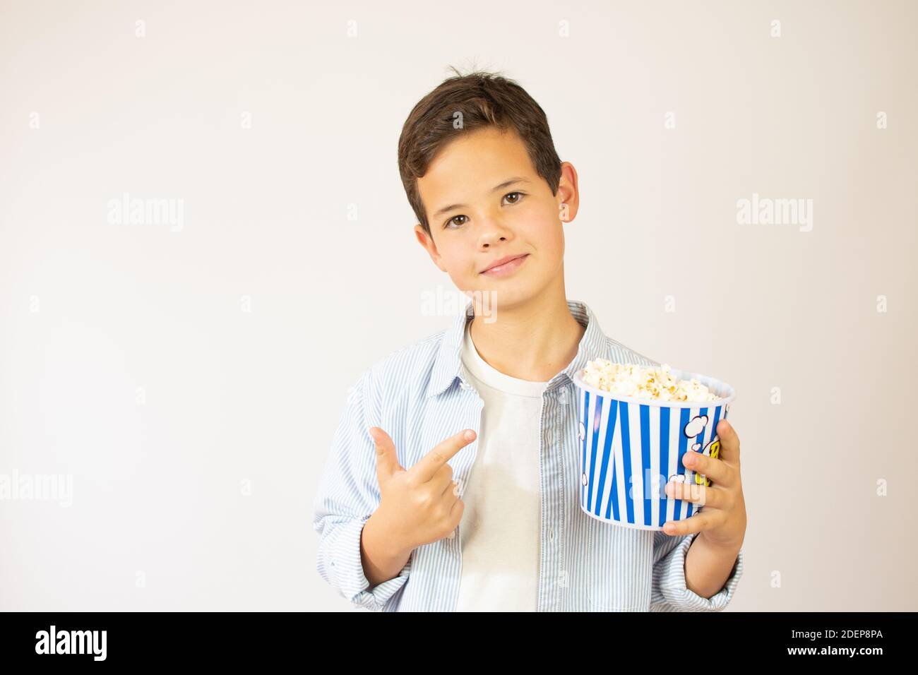 fast food, childhood and people concept - happy smiling boy eating ...