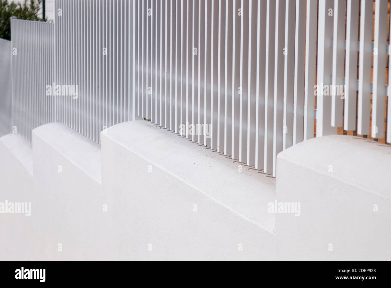 Tall wall with white iron fence on a house for protection Stock Photo ...
