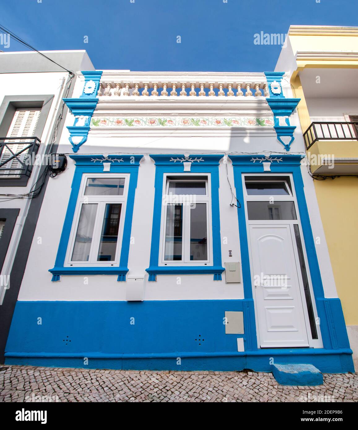 Typical Portuguese building of the Algarve region with colorful facades ...