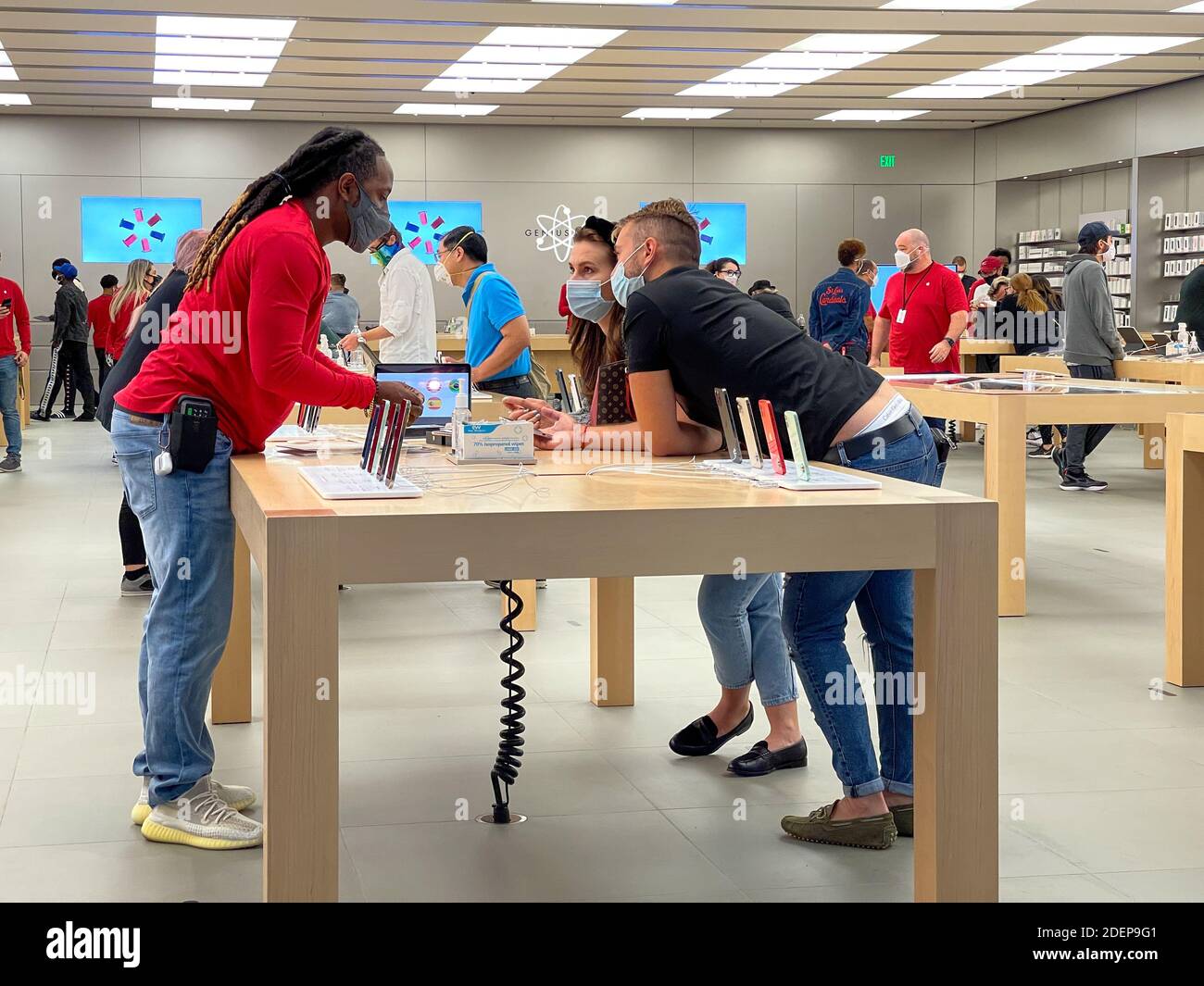 Orlando, FL USA - November 20, 2020: A salesperson and customers at an ...
