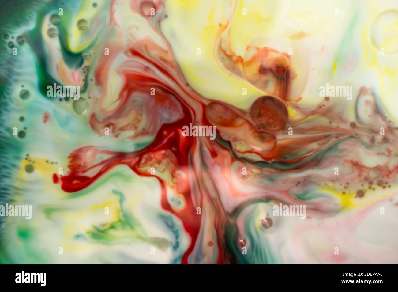 Strange abstract patterns made using milk and paint to be used as ...