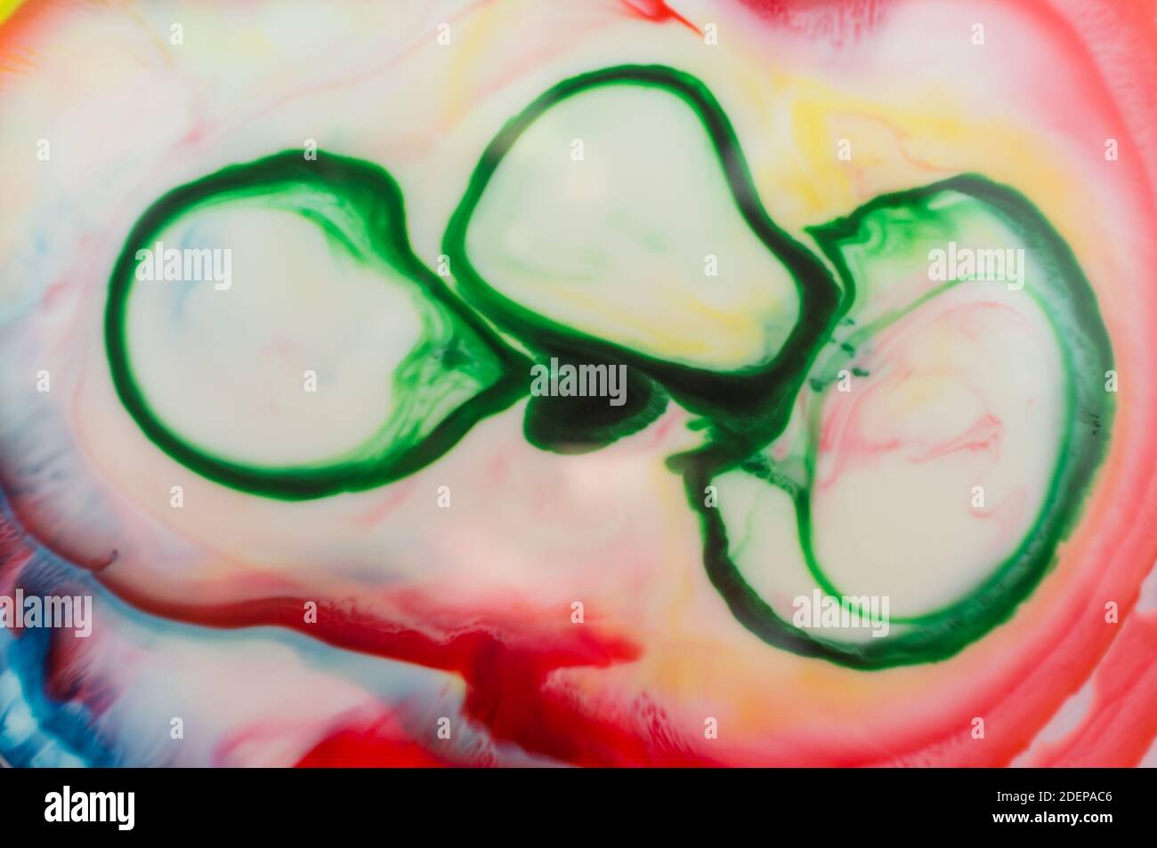 Strange abstract patterns made using milk and paint to be used as ...