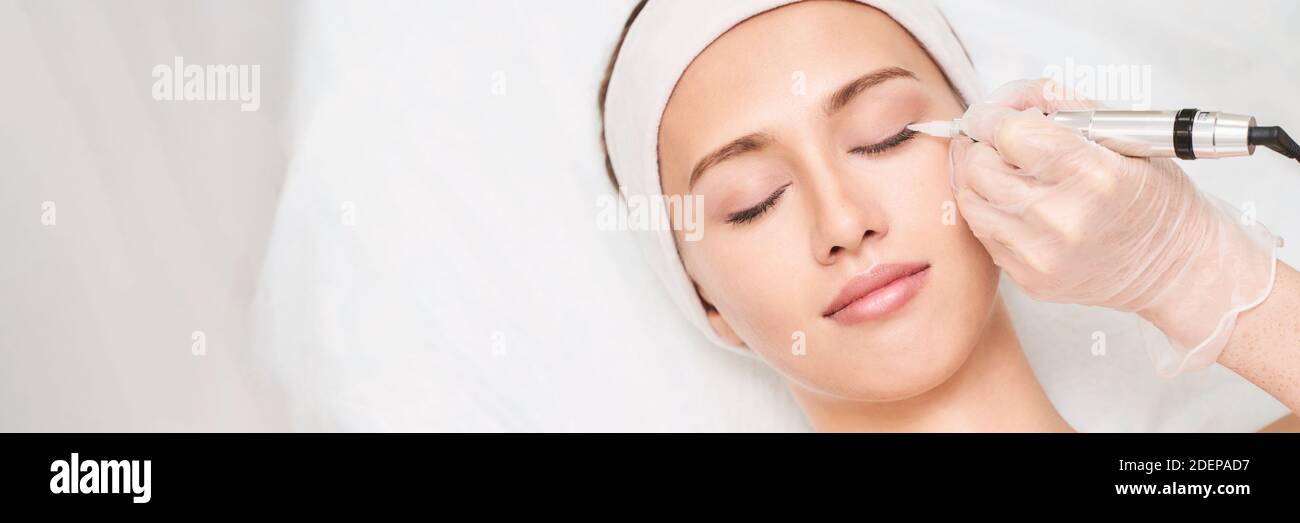 Permanent makeup. Beauty spa procedure. Beauty young woman Stock Photo ...