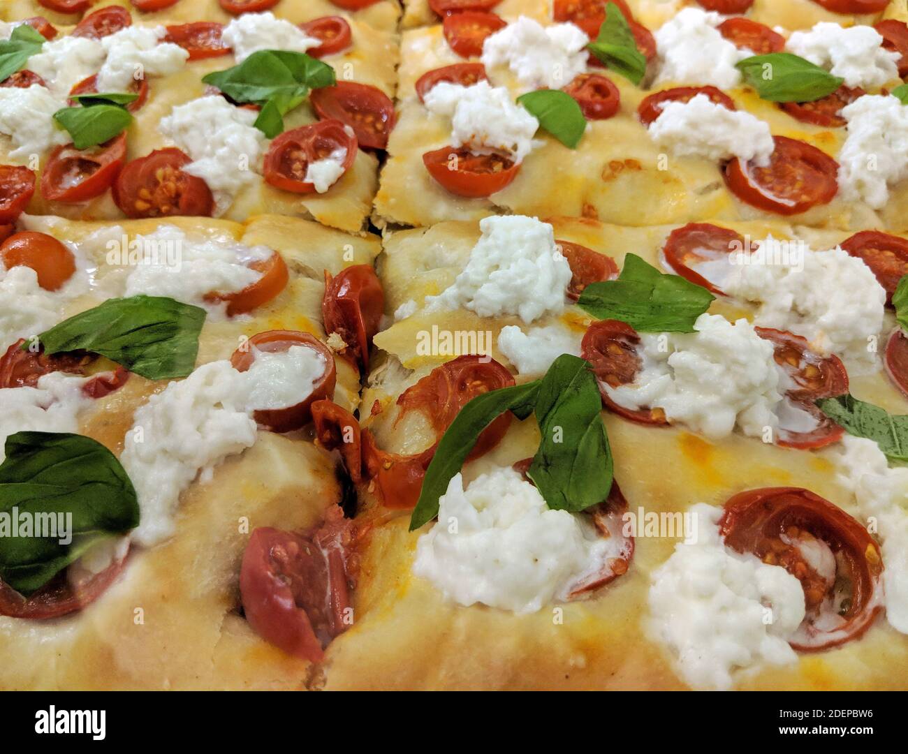 Closeup of traditional Italian Pizza by the slice (Pizza al Taglio ...