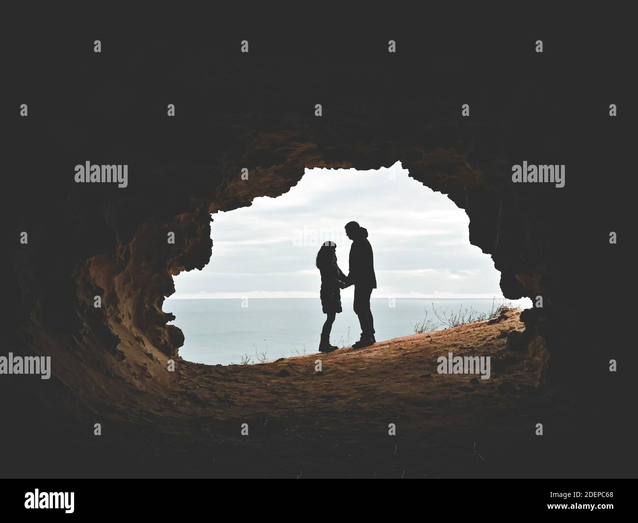 Romantic couple standing in front of the seascape. Picture of a ...