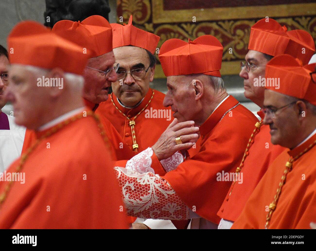 Cardinal Philippe Barbarin (France) (in the center) attends a ...