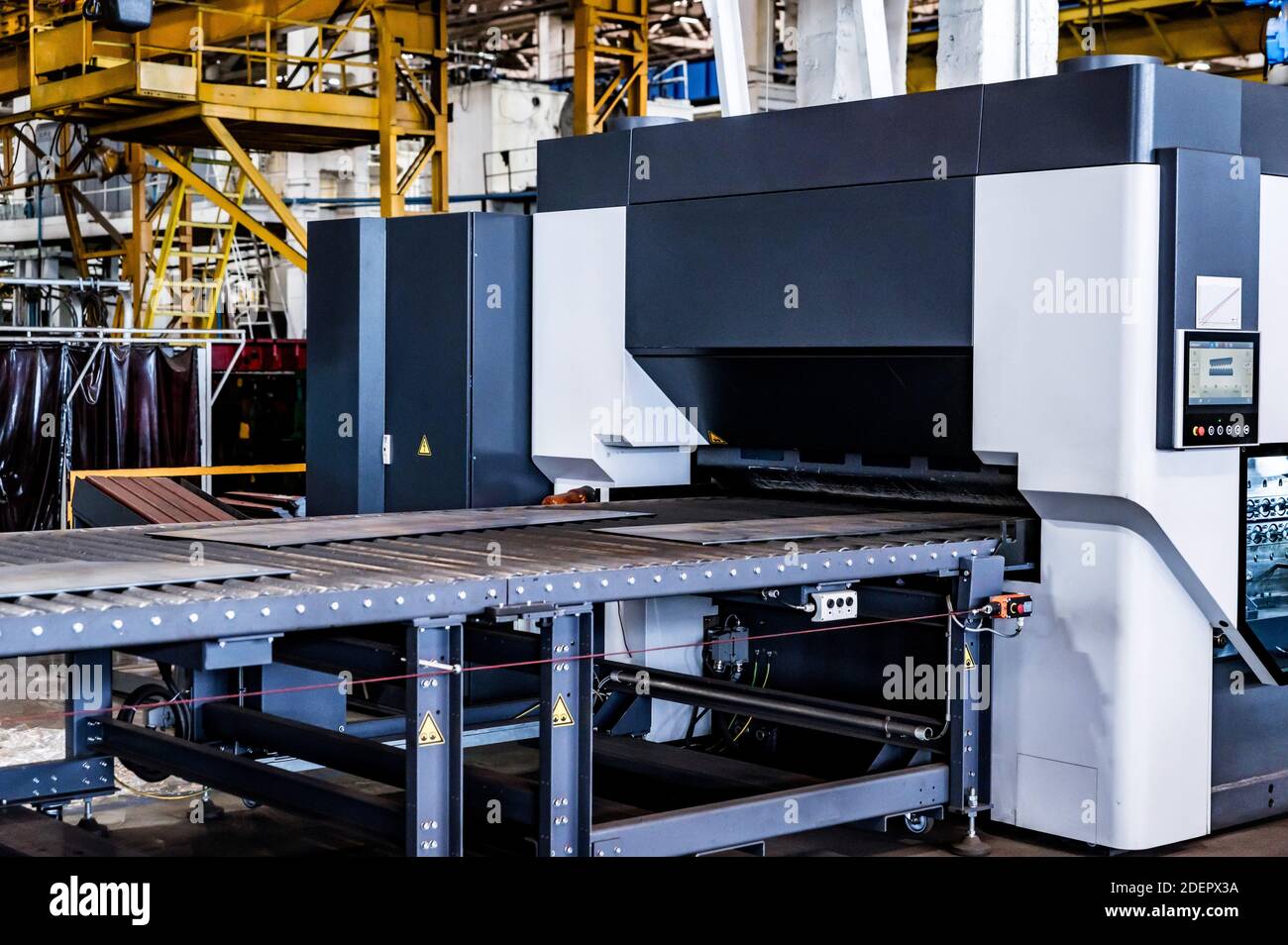 Parts leveler machine at assembly room at big industrial plant ...