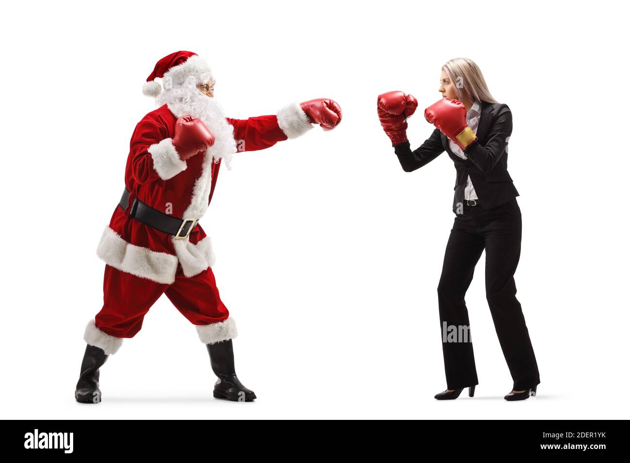 Full length profile shot of santa claus boxing with a businesswoman ...
