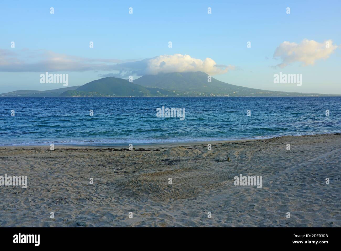 Sunset view of the Nevis Peak volcano across the water from St Kitts ...