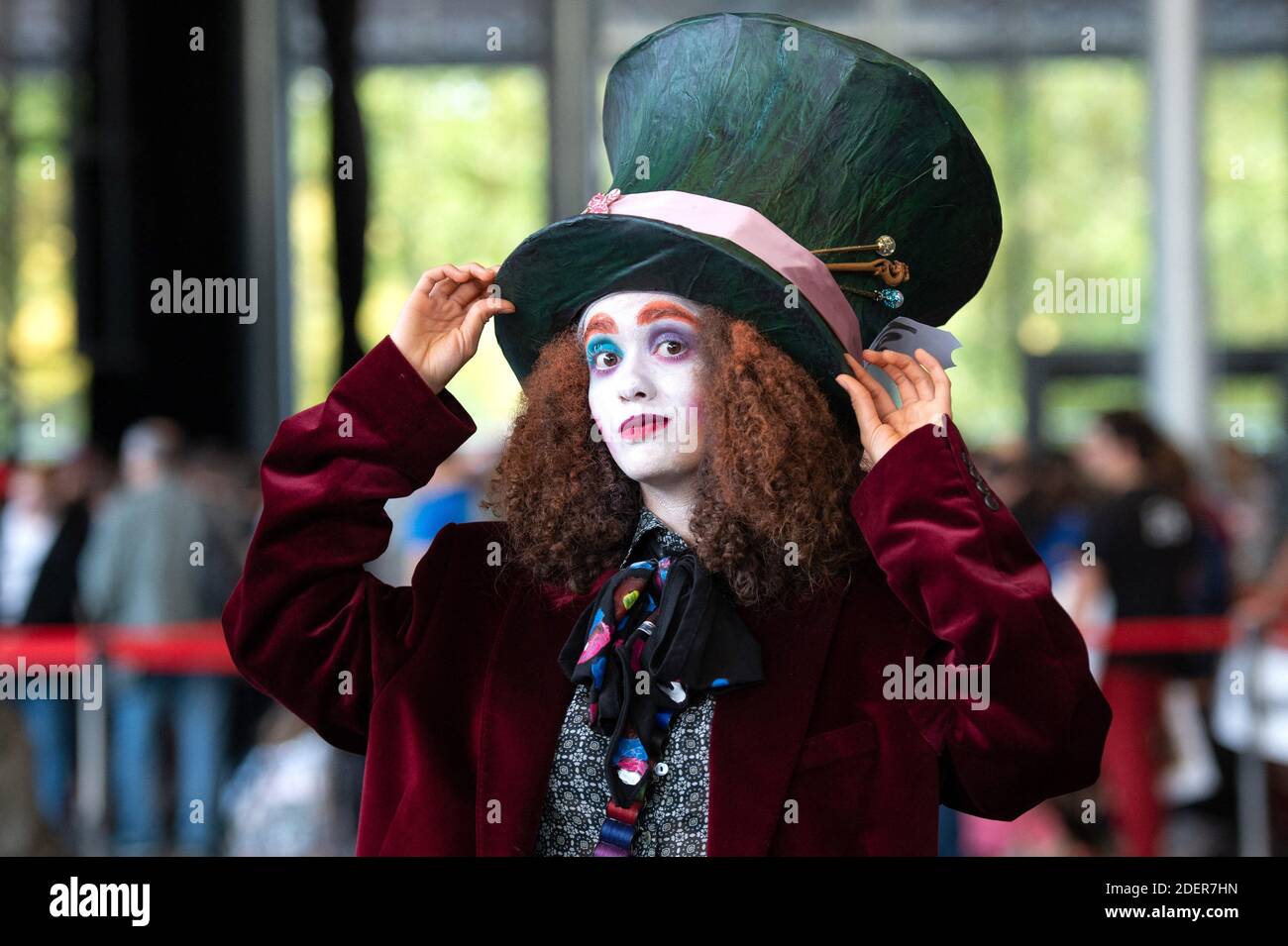 A cosplayer dressed as the Hatman (Alice in Wonderland) attending the ...