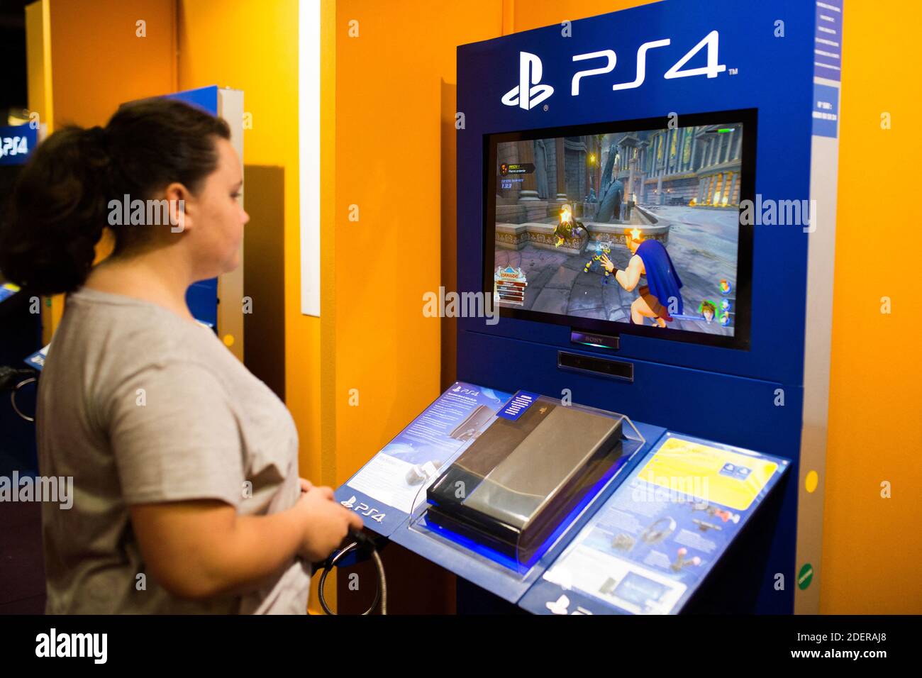 People playing video games on the Sony PS4 console at the Paris Games ...