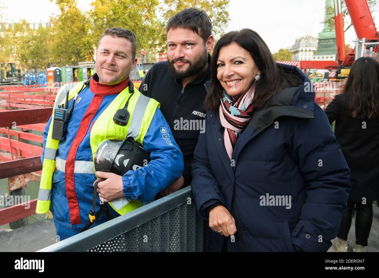 Paris mayor Anne Hidalgo (R) poses during a visit at a construction ...